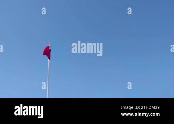Red flag Against the Blue Sky. Dangerous for Swimming, Storm Warning ...