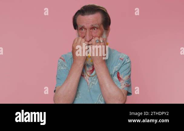 Upset scared frightened senior man biting nails, feeling worried ...