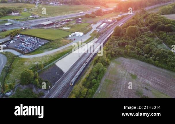 Fast Train moving on Tracks at Sunset Time Near Luton Town of England ...