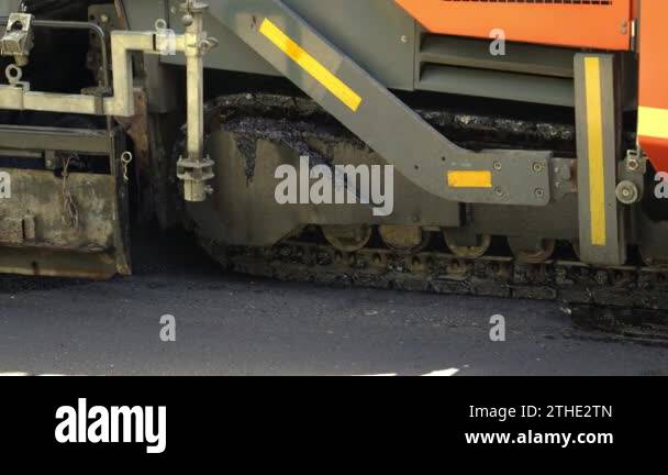 Replacing old asphalt when repairing the road surface. Asphalt paver ...