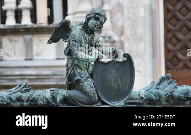 Angel with armor on the metal fence near the Cappella Colleoni (was ...