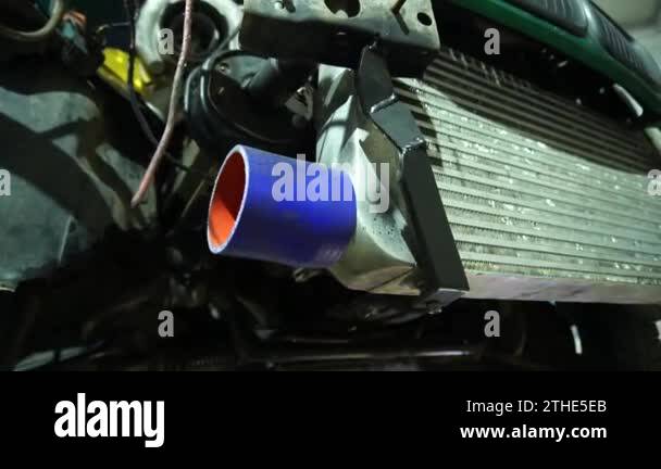 a mechanic builds and installs a cold air intake system on a drift car ...