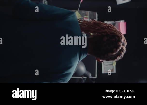 Vertical video: Law enforcement agent checking detective evidence map ...