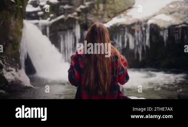 Female traveler finds inner peace in the beauty of nature, hiking through mountain ranges, and ...