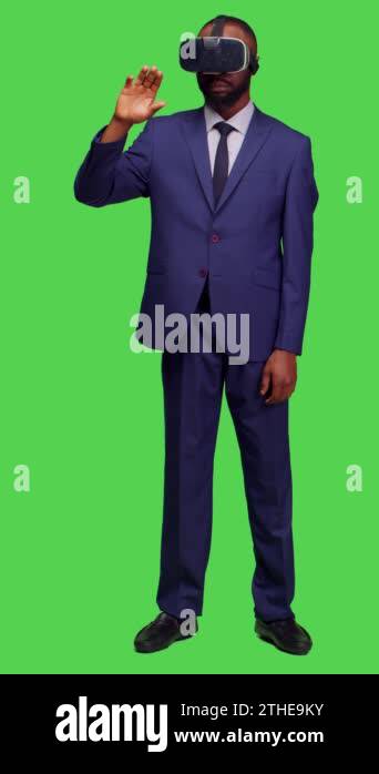 Vertical video: Front view of corporate employee using vr headset on ...