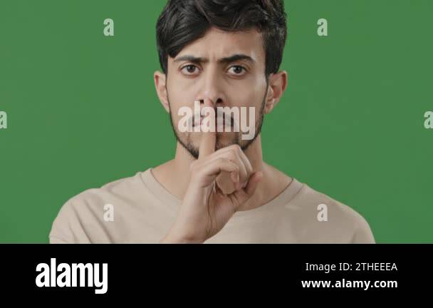 Close up serious arab guy looking at camera face young hispanic man ...