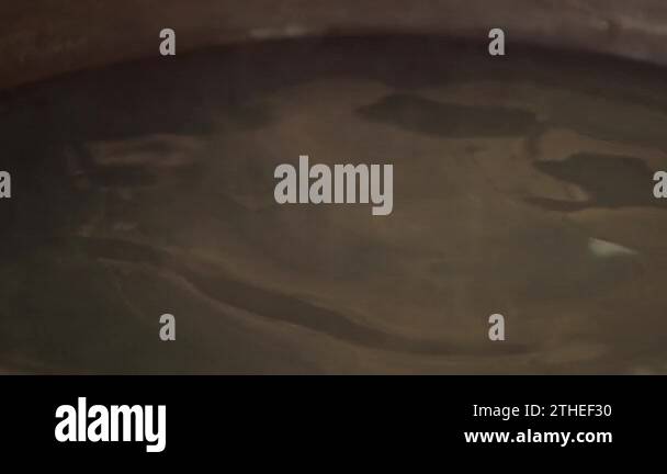 Surface of water in the hot tub. Underground natural hot water. Hot ...