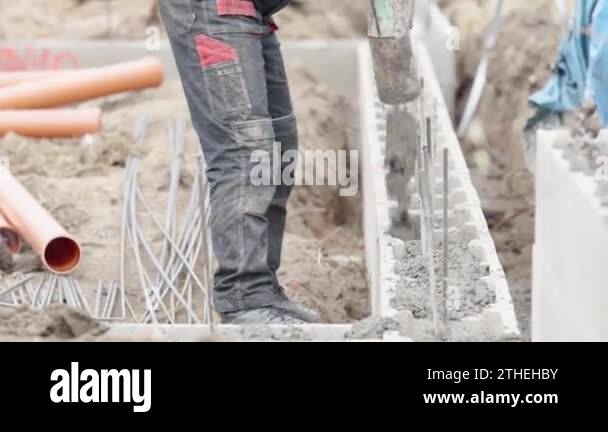 concreting from the pipe of the foundation of the building from the ...