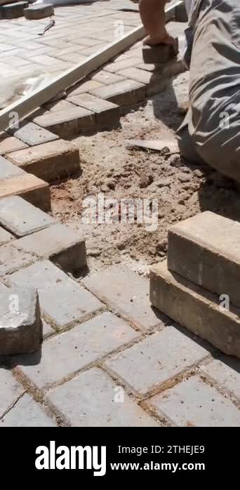 Brazilian and civil construction worker using a trowel to level the ...