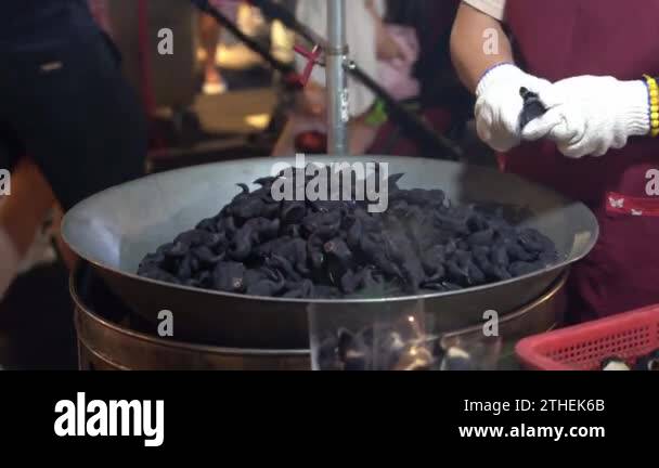 Cinematic zoom shot capturing hand cracking open unique food choice ...