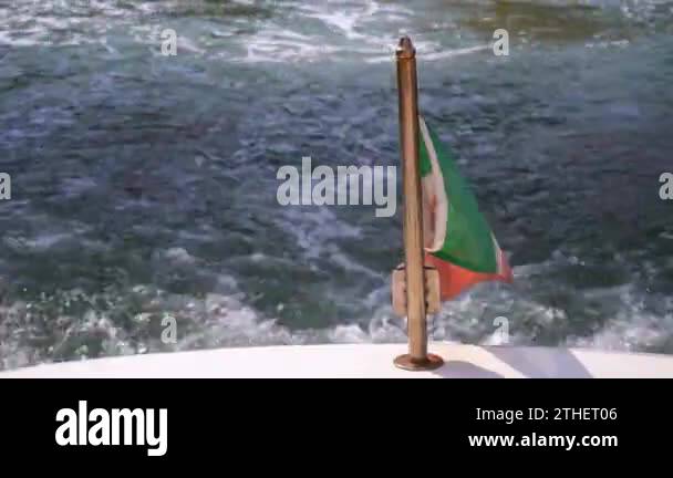 National Flag Of Italy As Civil Ensign On The Back Of Boat With ...