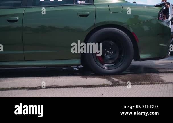 Wheel slip in place, to warm up the tire before the race. Smoke comes ...