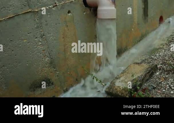Rainwater sewer drains excess water from the ground, water coming out ...