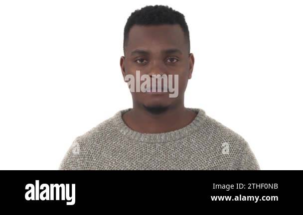 Handsome man winking his eye and showing hey you sign. Hand sign ...