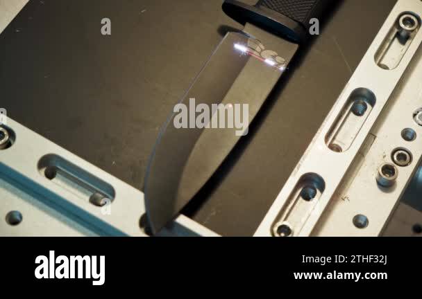 Process of laser engraving of hunting knife surface with wide blade ...