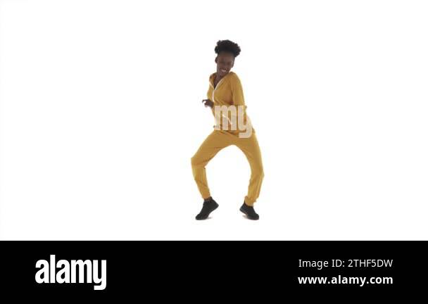 Full length portrait of dancing African woman. Dancer rhythmically ...