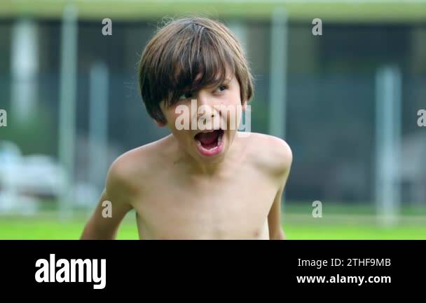 Adorable young boy yelling and laughing. Cute child screaming from the ...