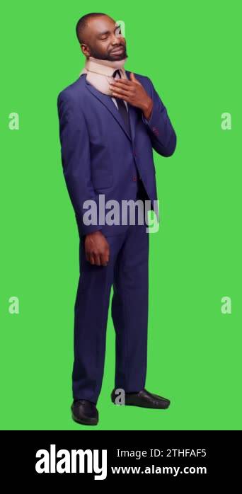 Vertical video: Side view of injured businessman wearing suit and ...