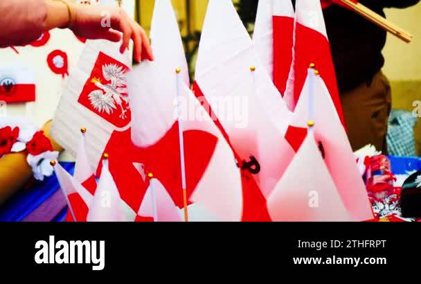 National Independence Day of Poland. Flag of Poland. The seller puts up ...