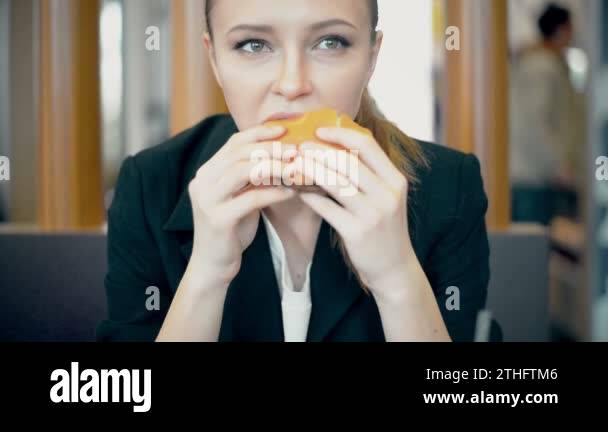 Young woman eating burger model Stock Videos & Footage - HD and 4K ...