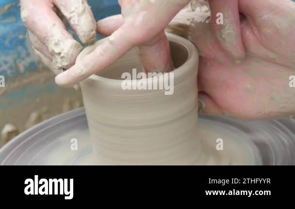 Clay modeling master class. Teacher show children hands clay pot ...