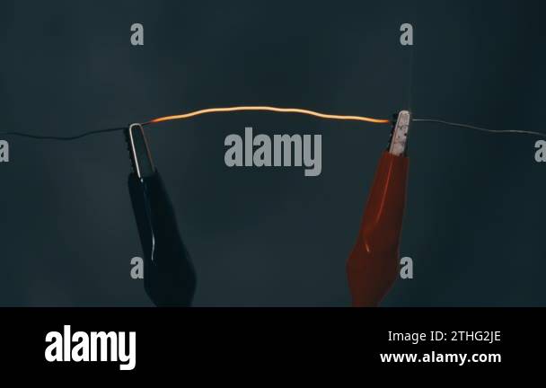 Nichrome wire heated to red under high current strength. Nichrome ...