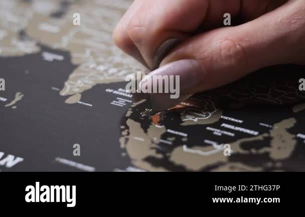 Scratching Thailand Country on the Surface of Scratch World Map. Woman ...