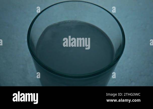 Top view effervescent bubbling in glass closeup. Air bubbles rising ...