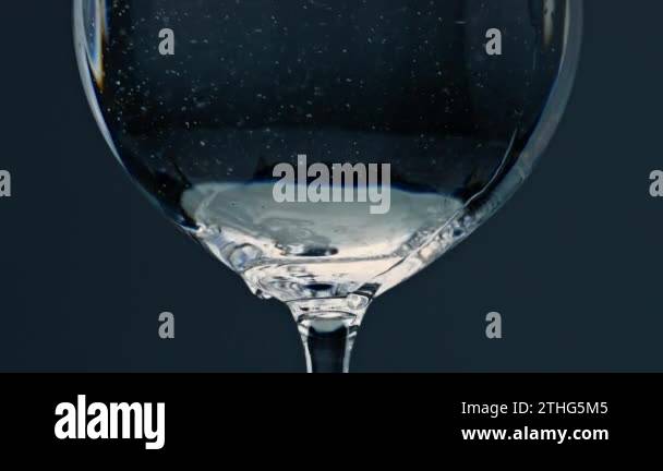 Full glass water bubbles rising up flowing closeup. Still refreshing ...