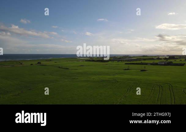 Clouds hung in the interim over the green fields. They portend a ...