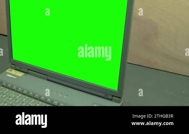 Computer laptop keyboard green screen ready for keying. Camera dolly ...