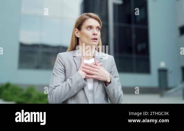 Young female employee has panic attack on the street. outside Woman ...