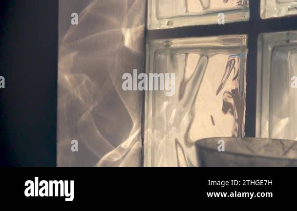 This shot focuses on the shapes made by light refracted through a ...