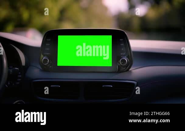 Close up display with green screen on car panel, car driving with ...