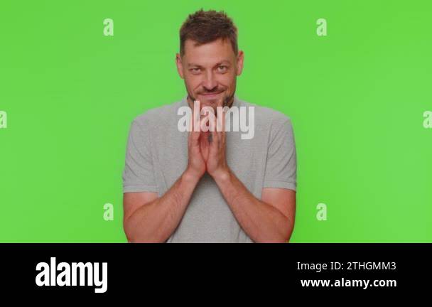 Sneaky cunning handsome man with tricky face gesticulating and scheming ...