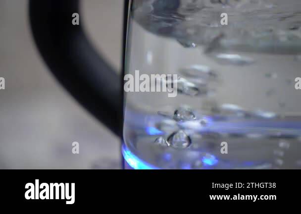 Electric glass kettle boils water. Measuring column, the amount of ...