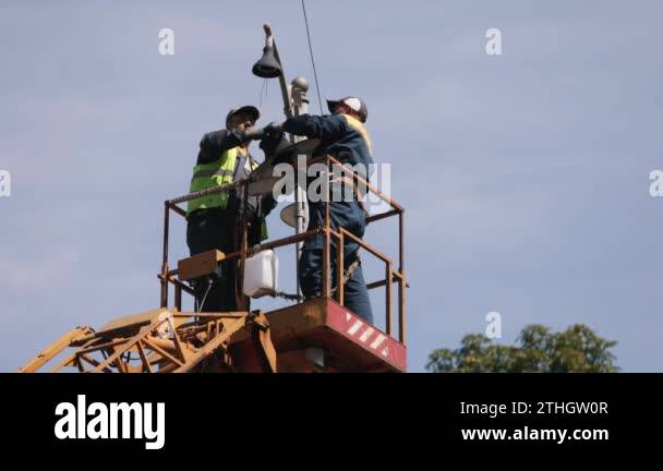 Electric technical, repair street lamp, equipment installs. Worker ...
