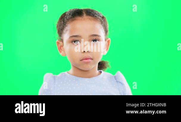 Eyebrow raise, green screen and child face of a young girl with a funny ...