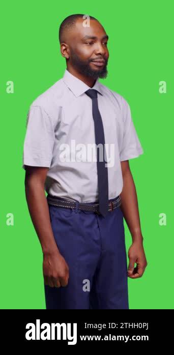 Vertical video: Side view of african american man standing over ...