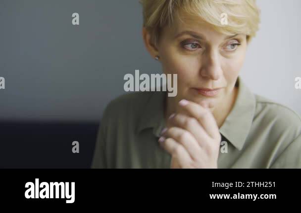 Lonely woman crying looking at window, saying bye to beloved one who ...