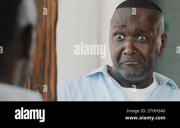 Emotional funny african american adult playful man comic make humorous ...