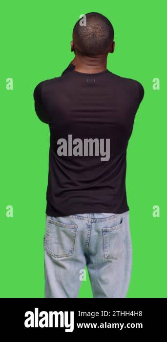 Vertical video: Back view of spiritual person praying to god in studio ...