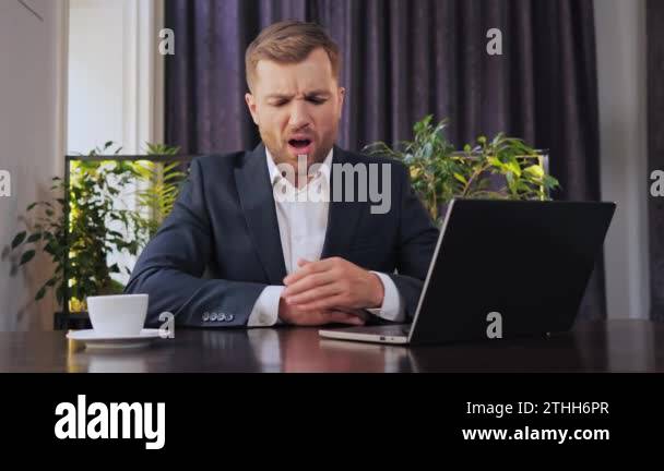 Businessman sitting in restaurant suddenly feeling strong stomach ache ...