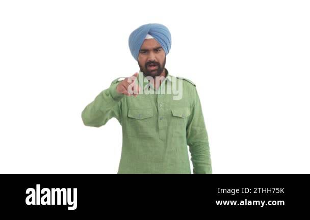 Young beard Indian man pointing at camera and twisting index finger ...