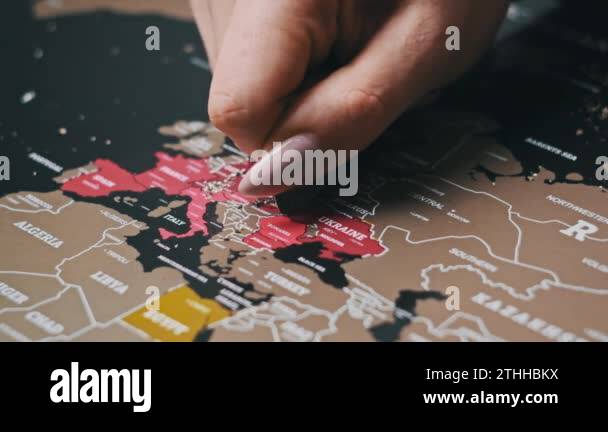 Female Hand Scratching Europe countries on the Surface of Scratch World ...