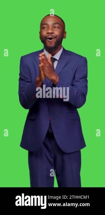 Vertical video: Front view of positive optimistic adult clapping hands ...