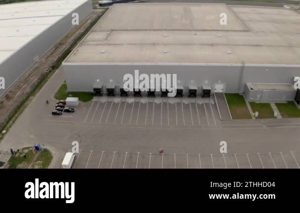 Engineers walk to check large storage terminal with loading docks for ...