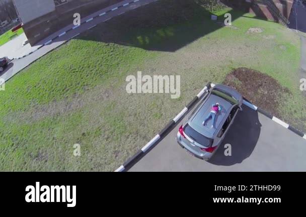 Girl on car roof Stock Videos & Footage - HD and 4K Video Clips - Alamy