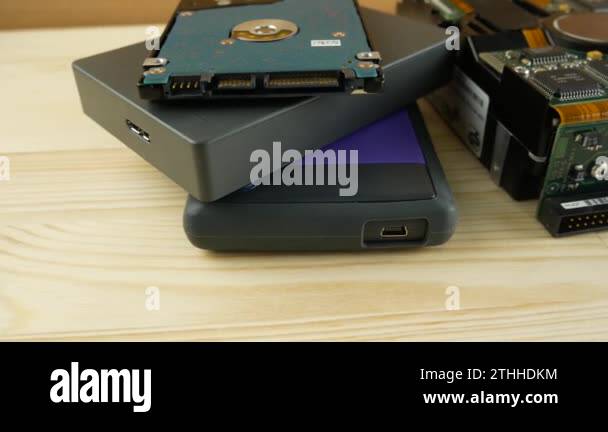 Several hard drives and file drives on the table. Storage of ...