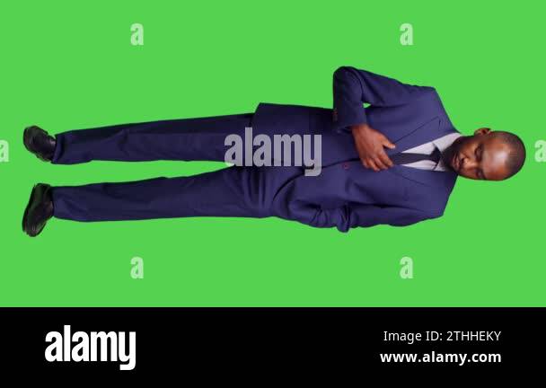 Vertical video: Front view of african american man in suit waiting for ...